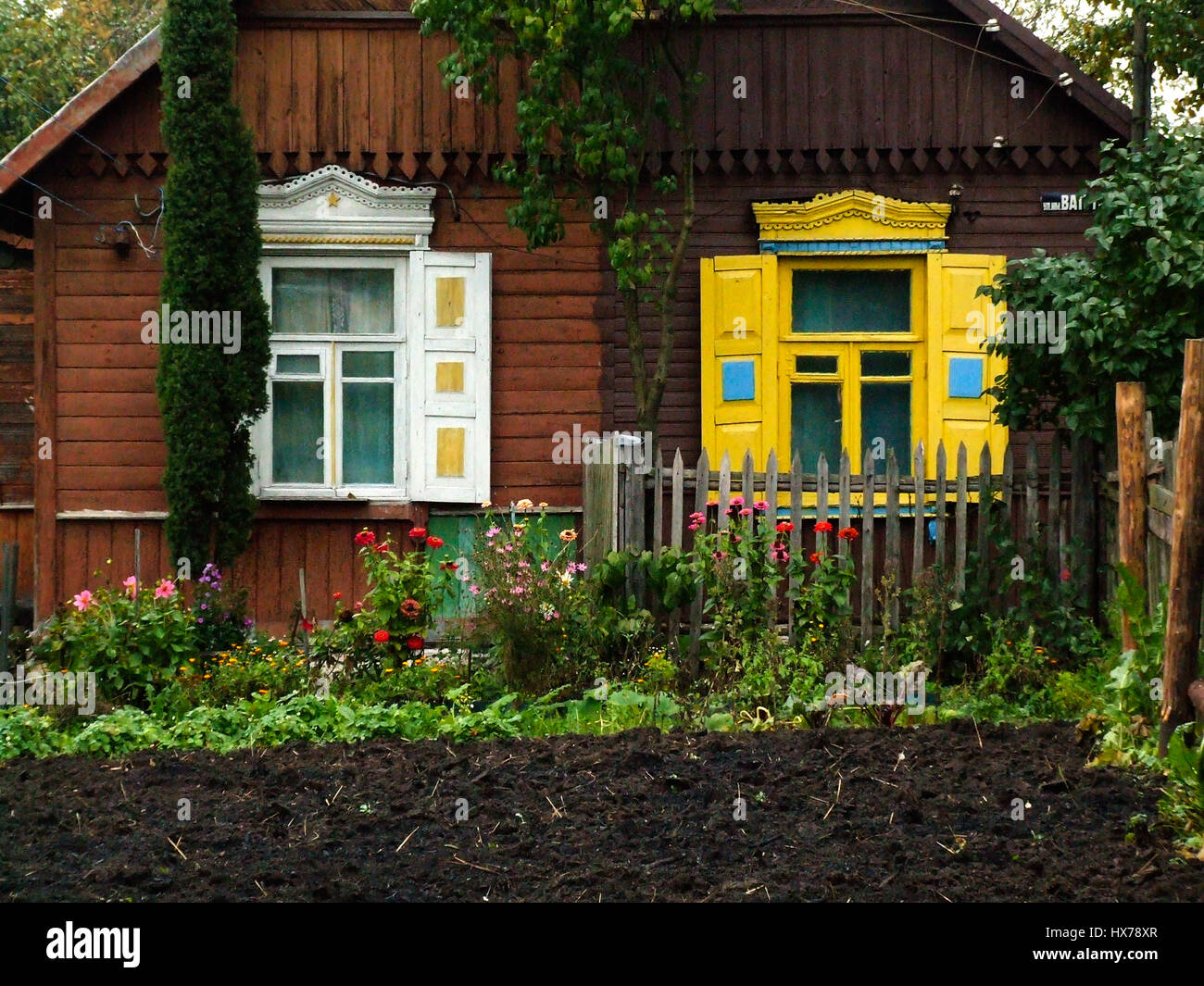 A traditional Russian house, made of wood or timbers and with ...