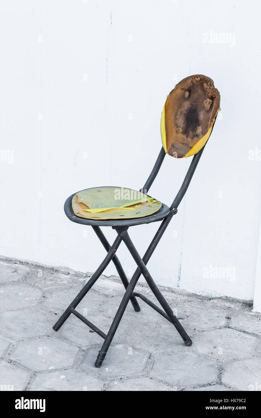 Broken Metal Wood Chair on Brick Floor Stock Photo - Alamy