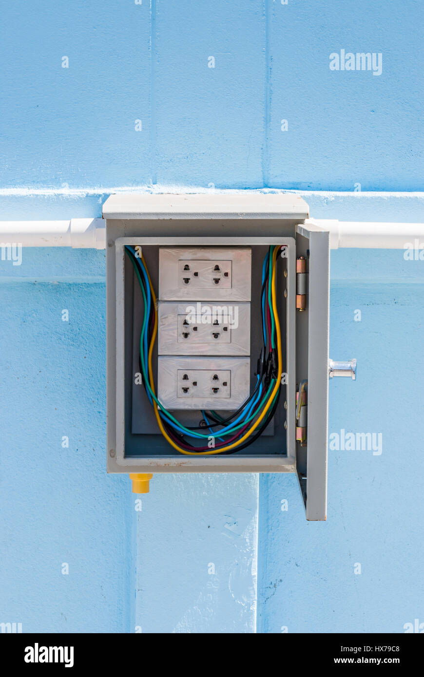 Wrapped White Electric Power Outlet in Gray Cabinet Stock Photo - Alamy