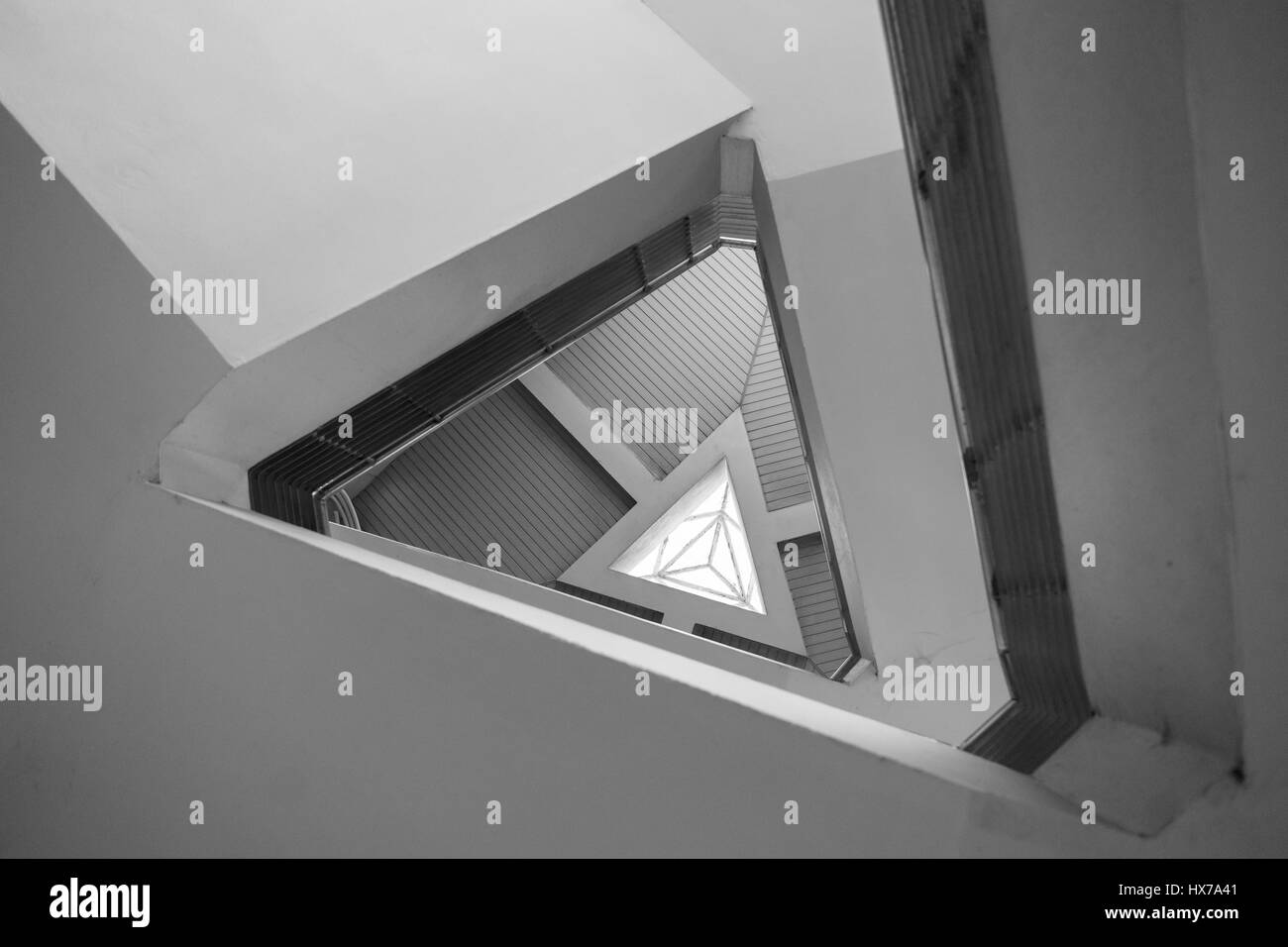Triangular stair case architectural style looking up Stock Photo - Alamy