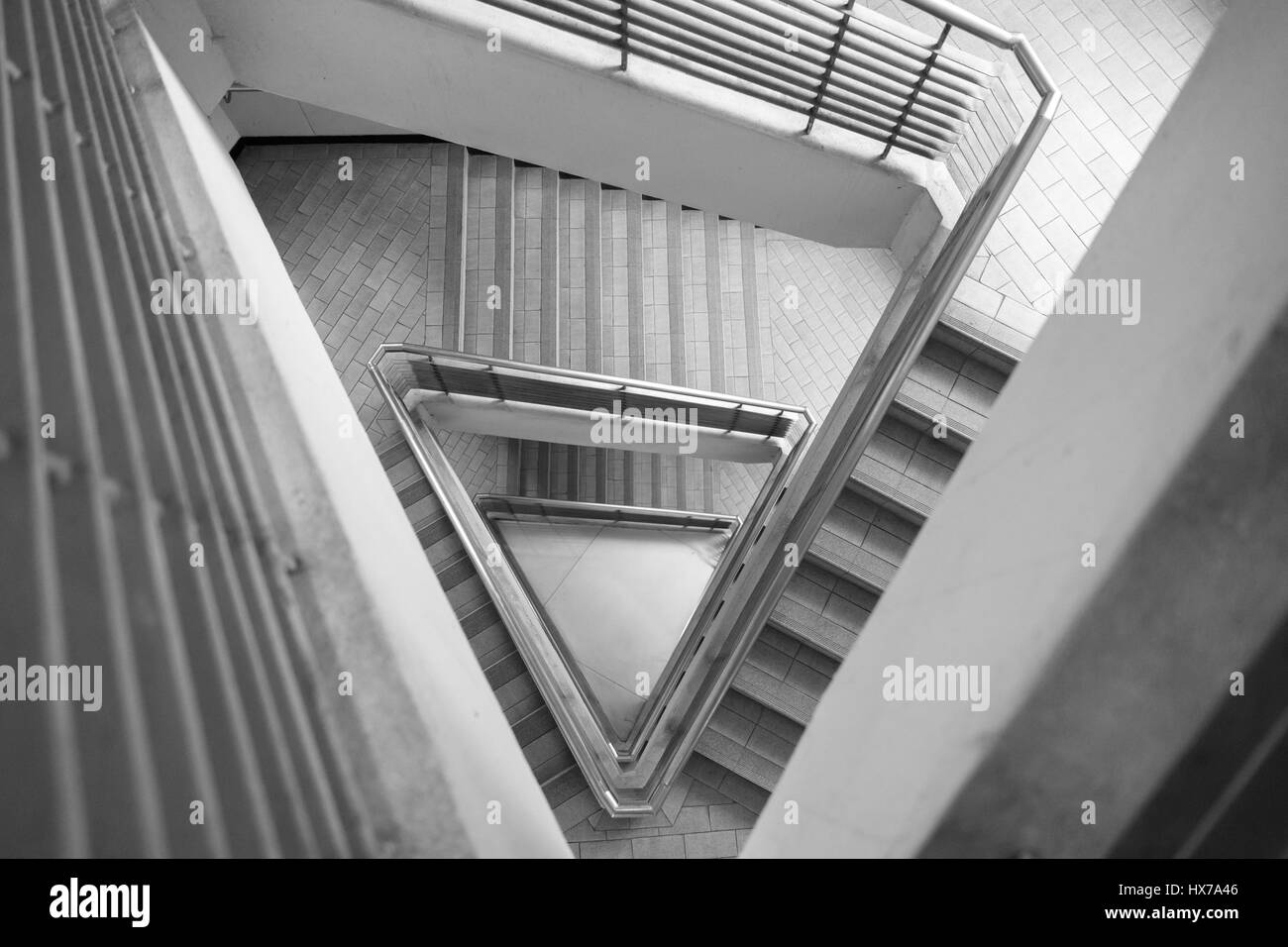 Triangular stair case architectural style looking up Stock Photo - Alamy