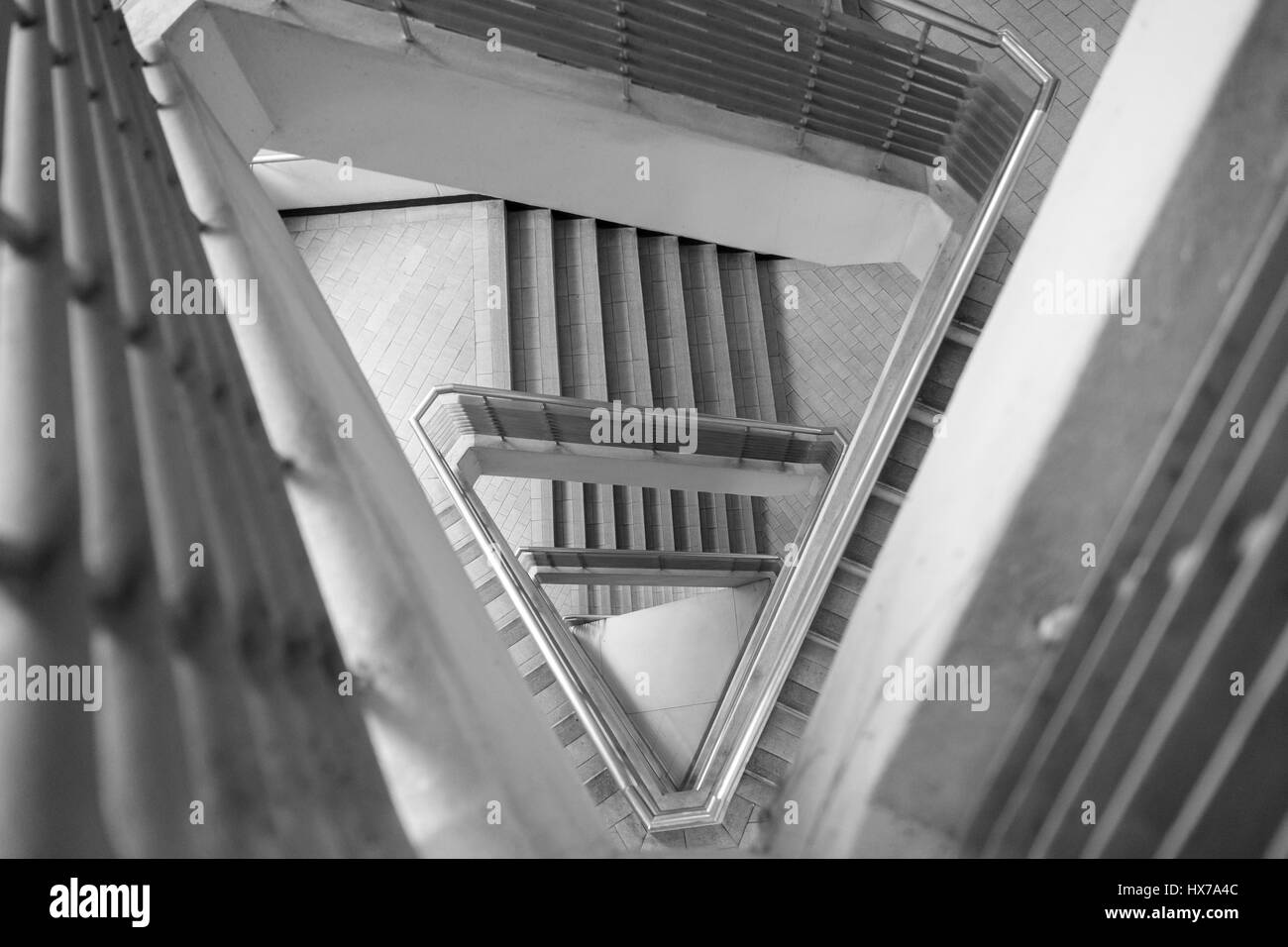 Triangular stair case architectural style looking up Stock Photo - Alamy