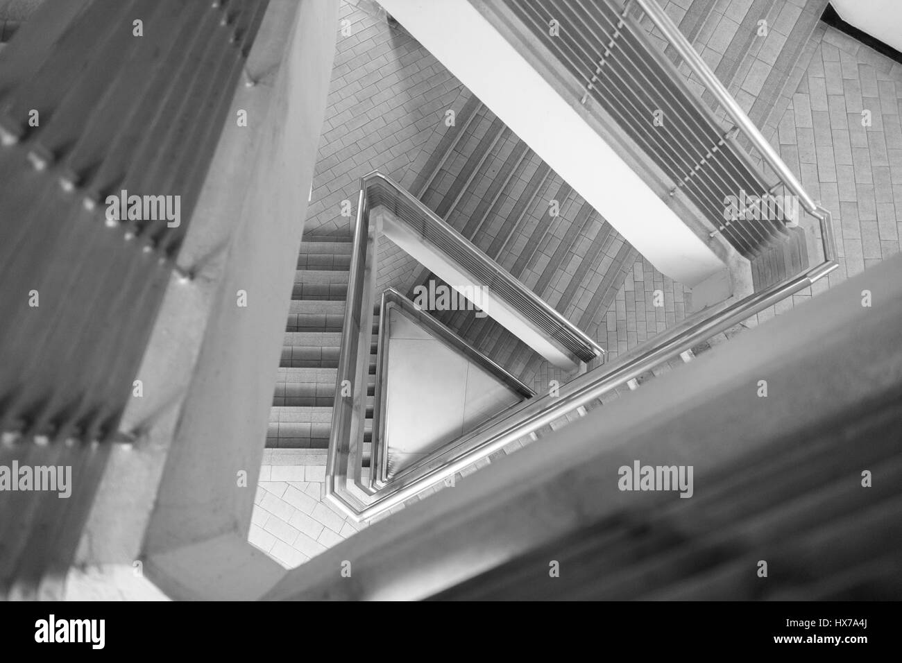Triangular stair case architectural style looking up Stock Photo - Alamy