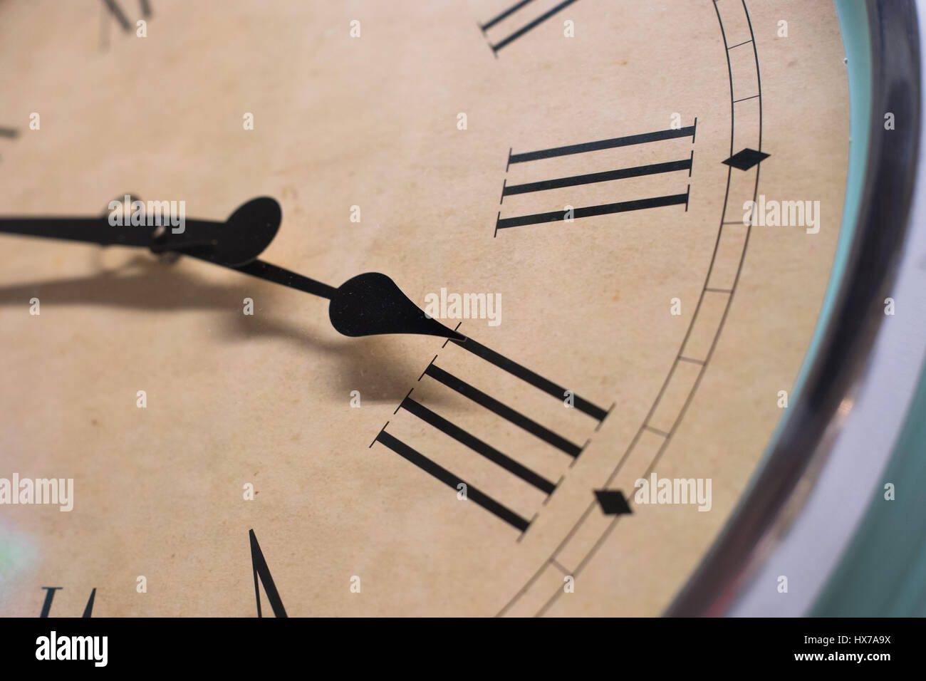 Close up on clock hanging on the wall Stock Photo - Alamy