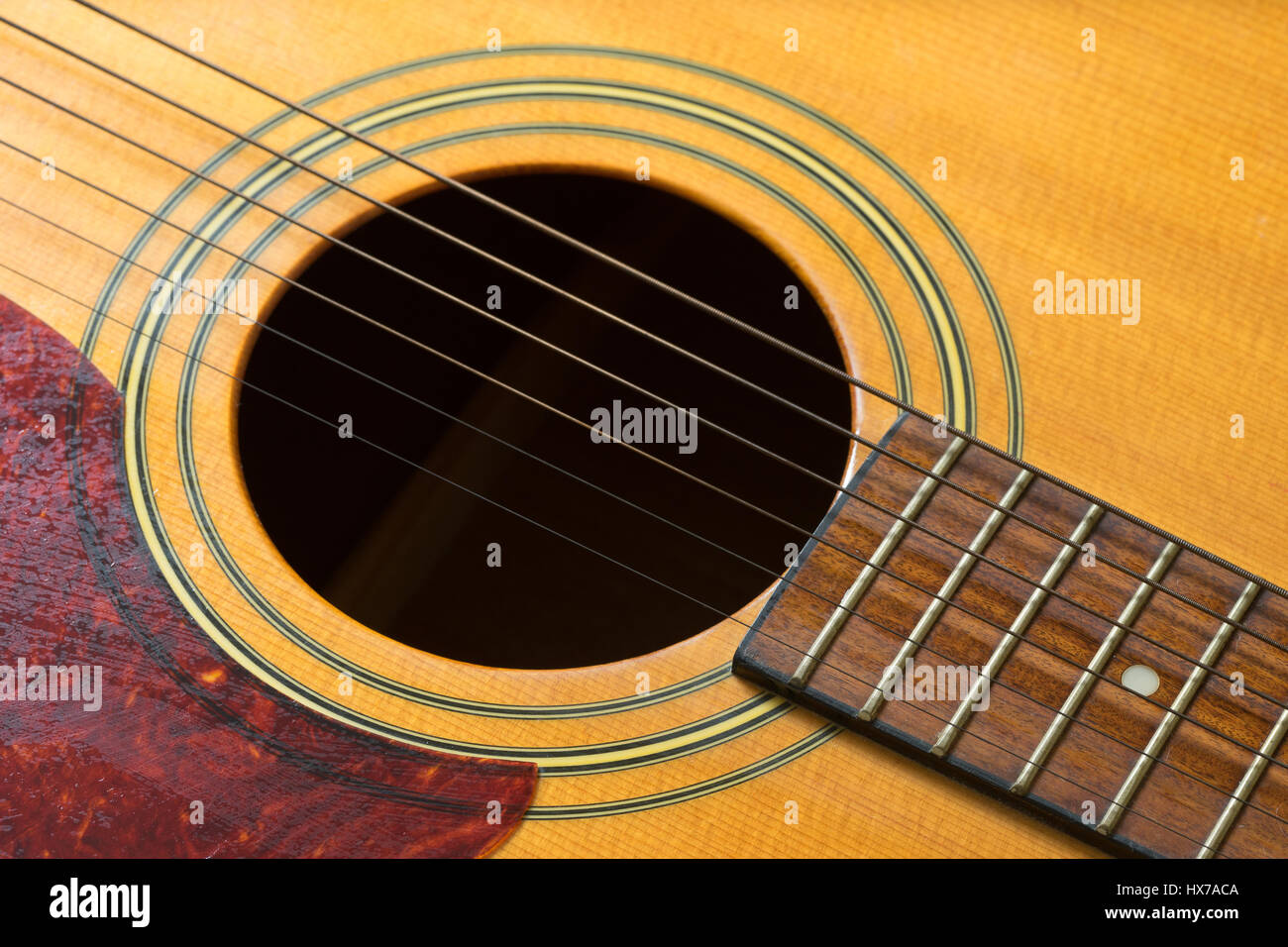 Close up on a classic guitar made of wood Stock Photo - Alamy
