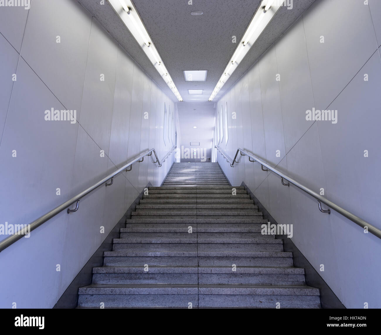Passage way with stairs going underground in a subway Stock Photo - Alamy