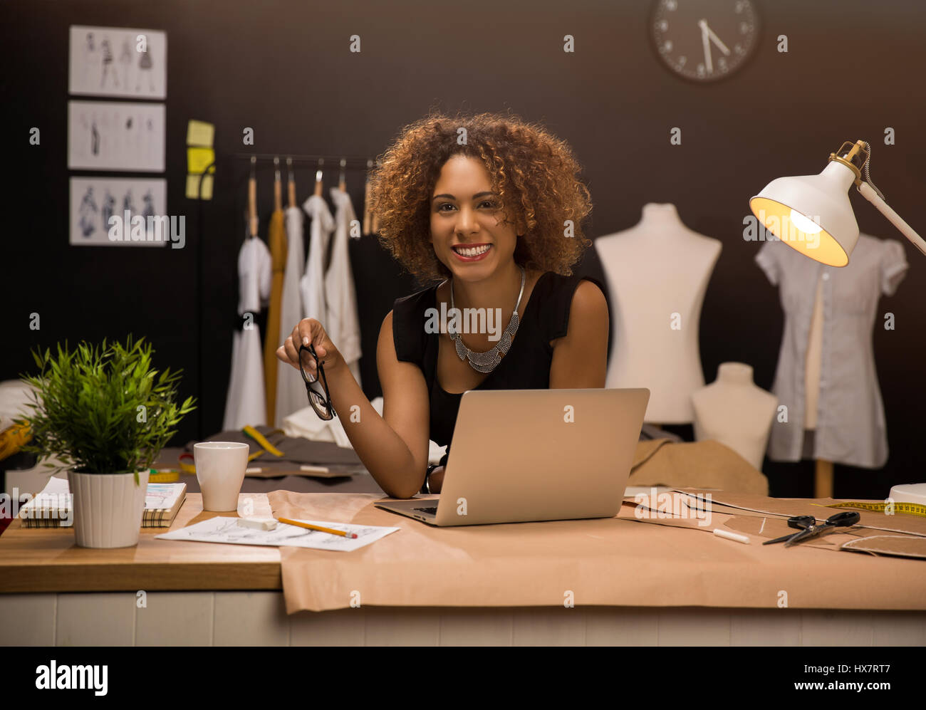 Two young entrepreneur women, and fashion designer working on her ...