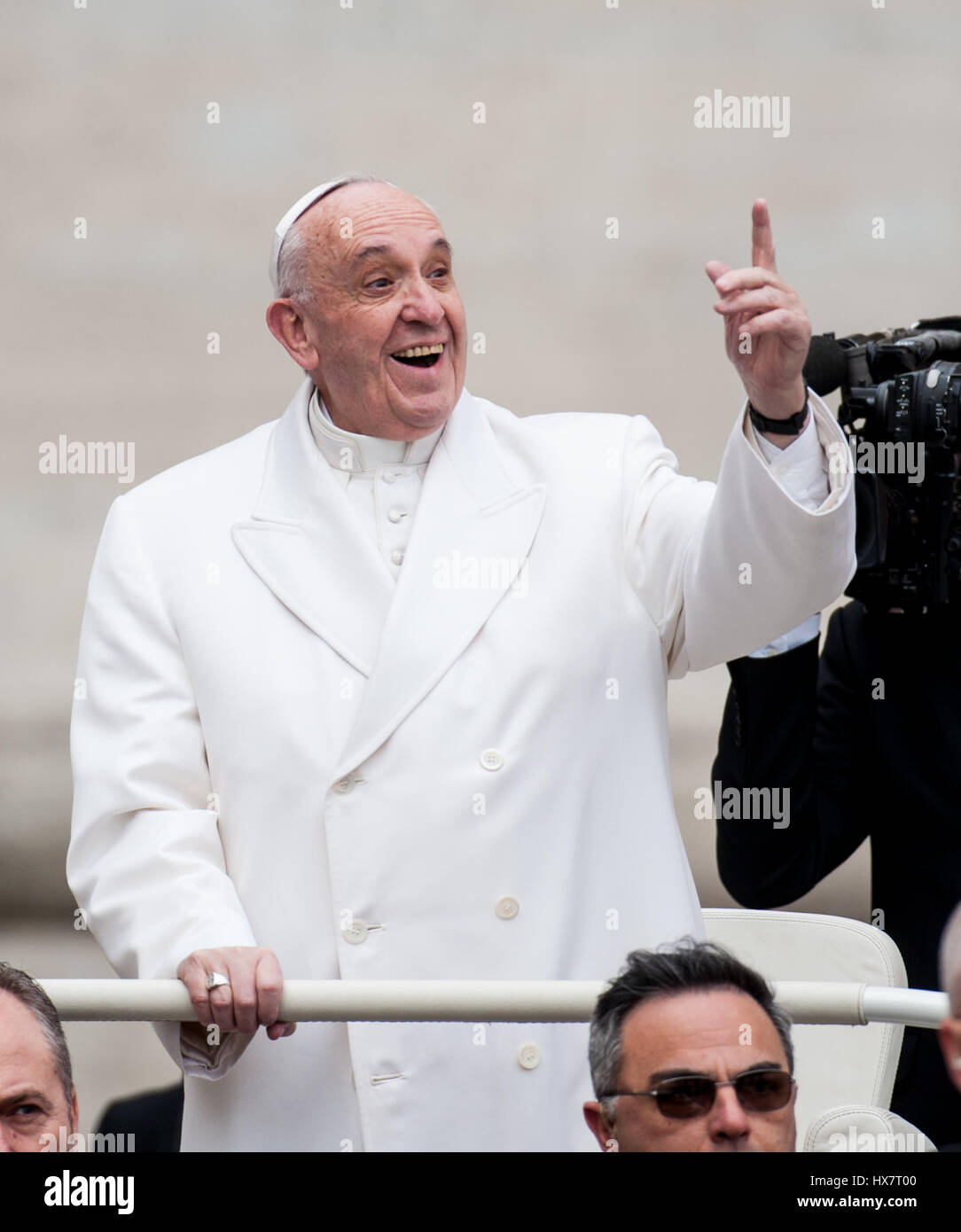 Pope Francis points the finger to the sky as he arrives to lead the ...