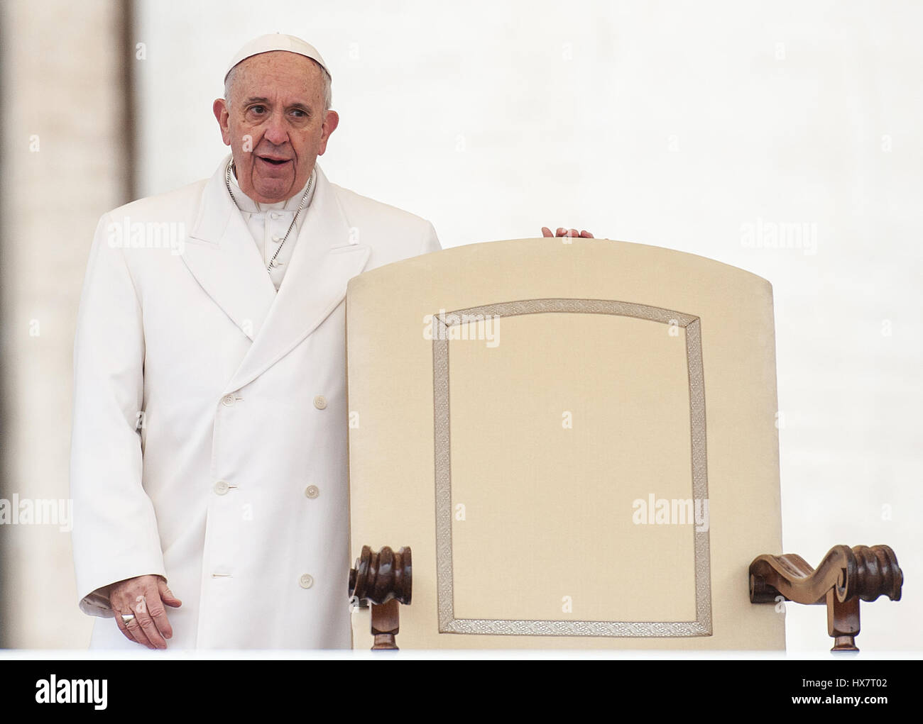 Pope Francis walks to his chair at the start of his weekly general ...