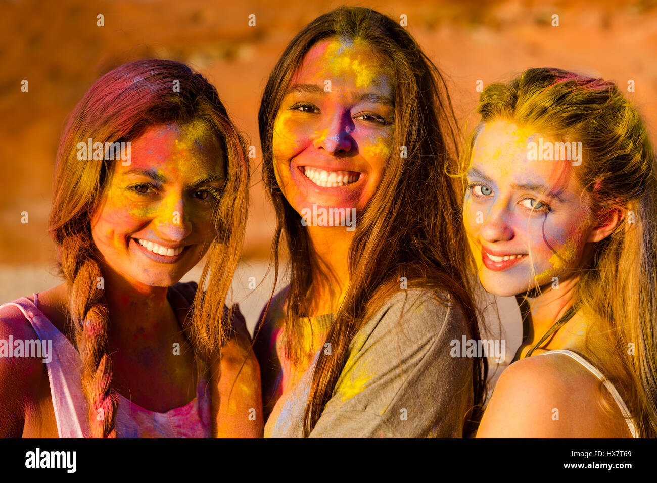 Best friends full of colored powder all over the body Stock Photo - Alamy