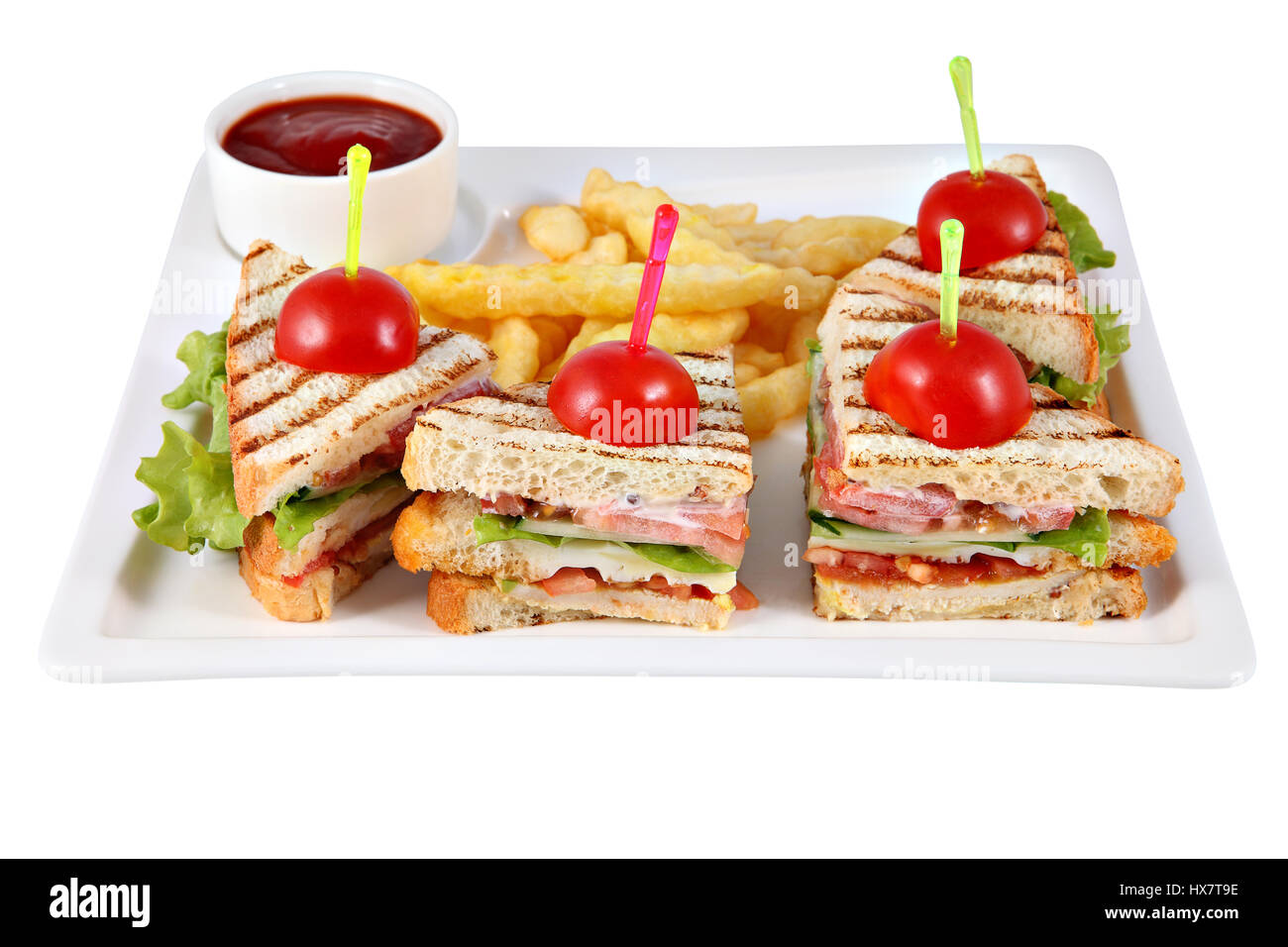 Club sandwich with chicken fillet, French fries, tomato sauce, on white ...