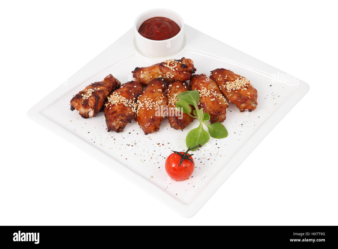 Fried chicken wings on white square serving plate, isolated on white ...