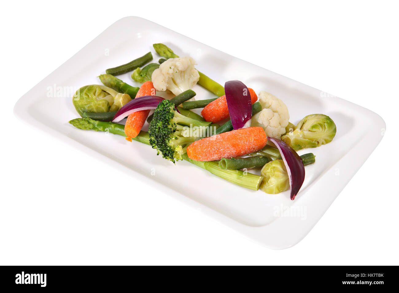 Vegetarian dishes, steamed vegetables on a white rectangular plate ...