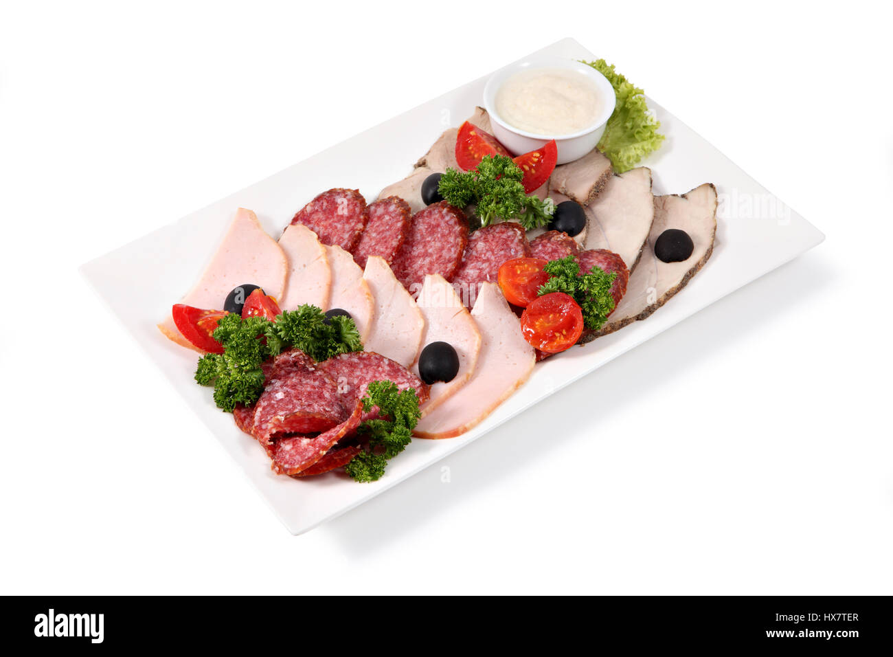 Meat delicacies on a white plate, cold cuts slice, isolated image on a ...