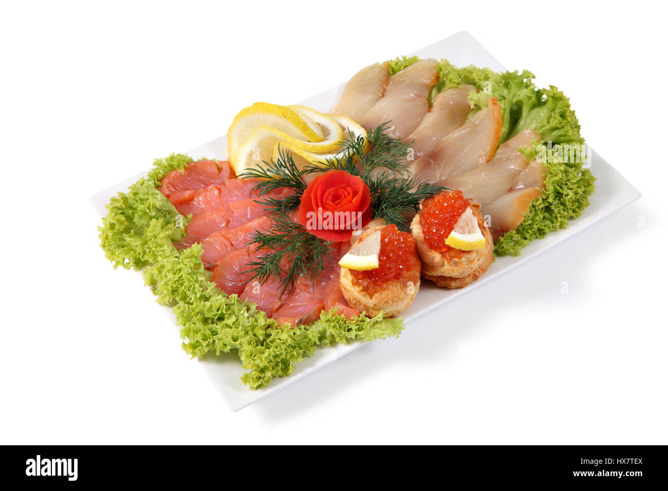 Assorted fish on a plate, a set of slices of salty smoked salmon ...