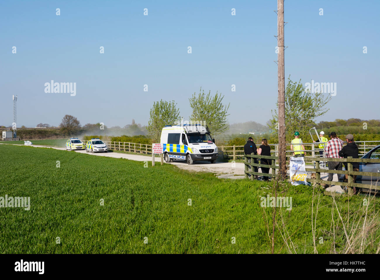 Police vehicles leaving iGas site at Doe Green with arrested protesters ...