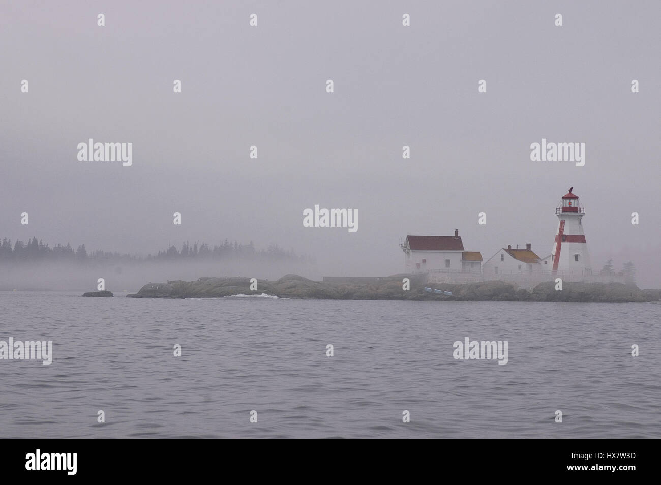 Lighthouse in fog Stock Photo - Alamy