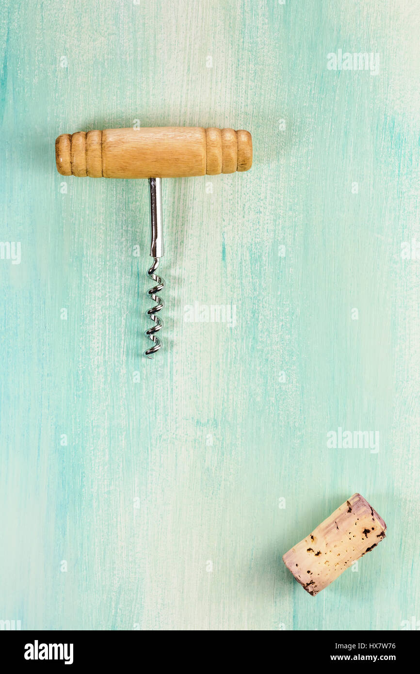 A photo of an old-fashioned corkscrew with a cork, shot from above on a ...