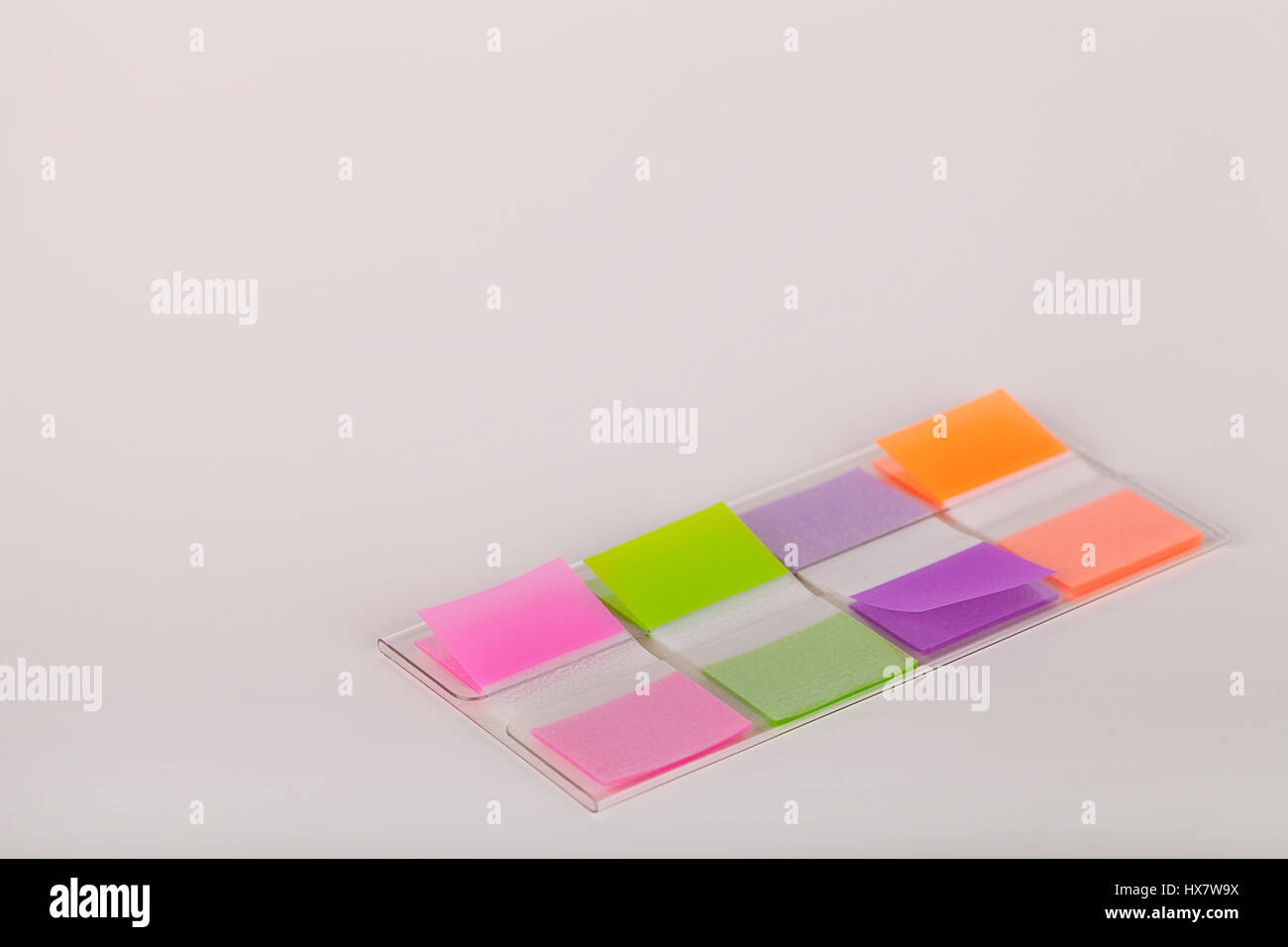 Colorful sticky tabs on a white surface. Post It tabs isolated on white ...