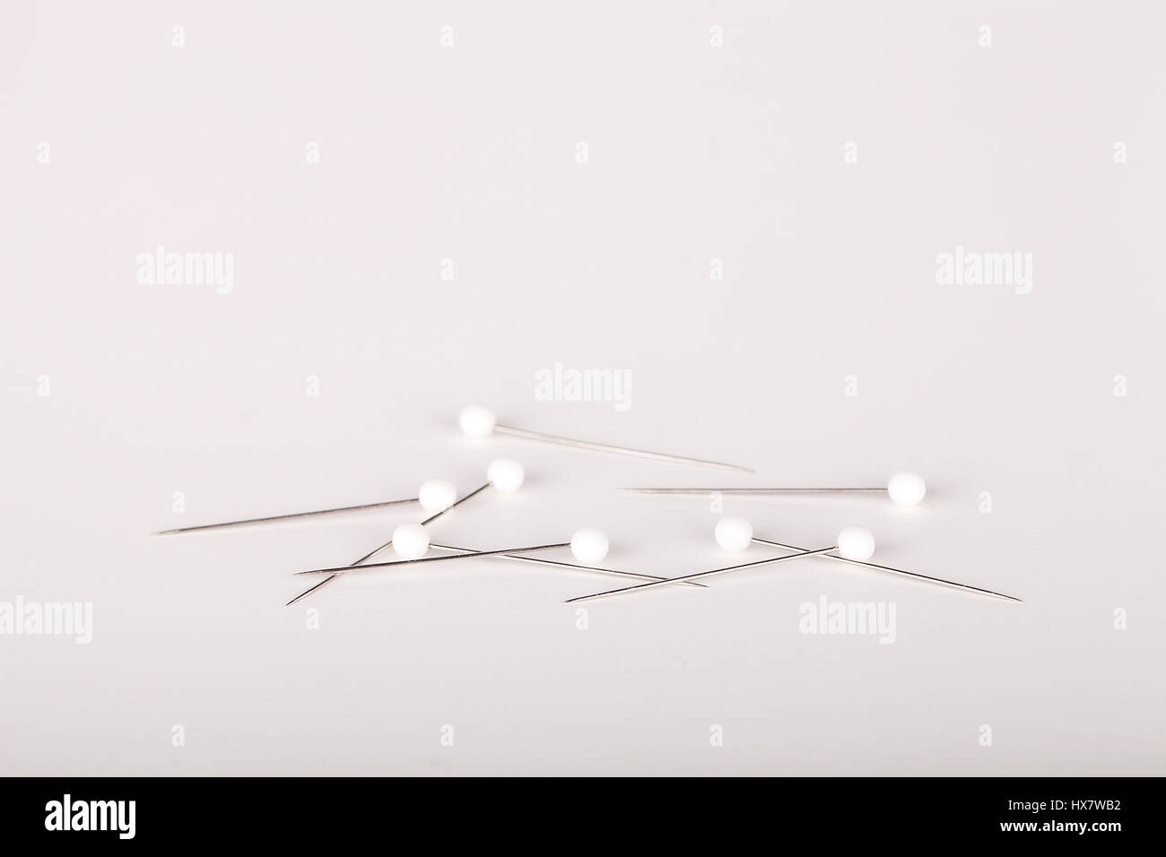 Pile of white straight pins isolated on white background Stock Photo ...