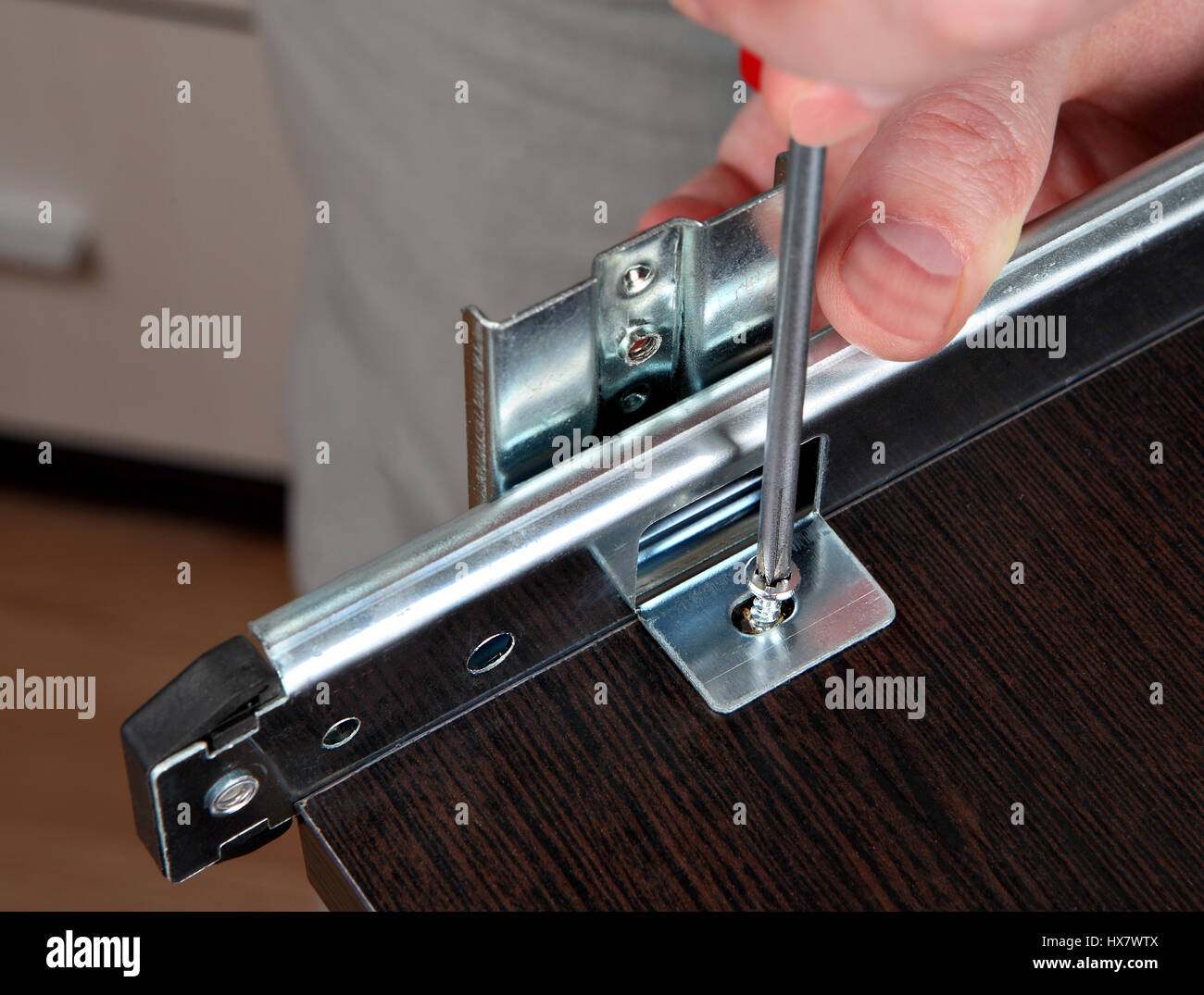 Assembling Of Furniture Installing Track Drawer Slide Rail Screwing