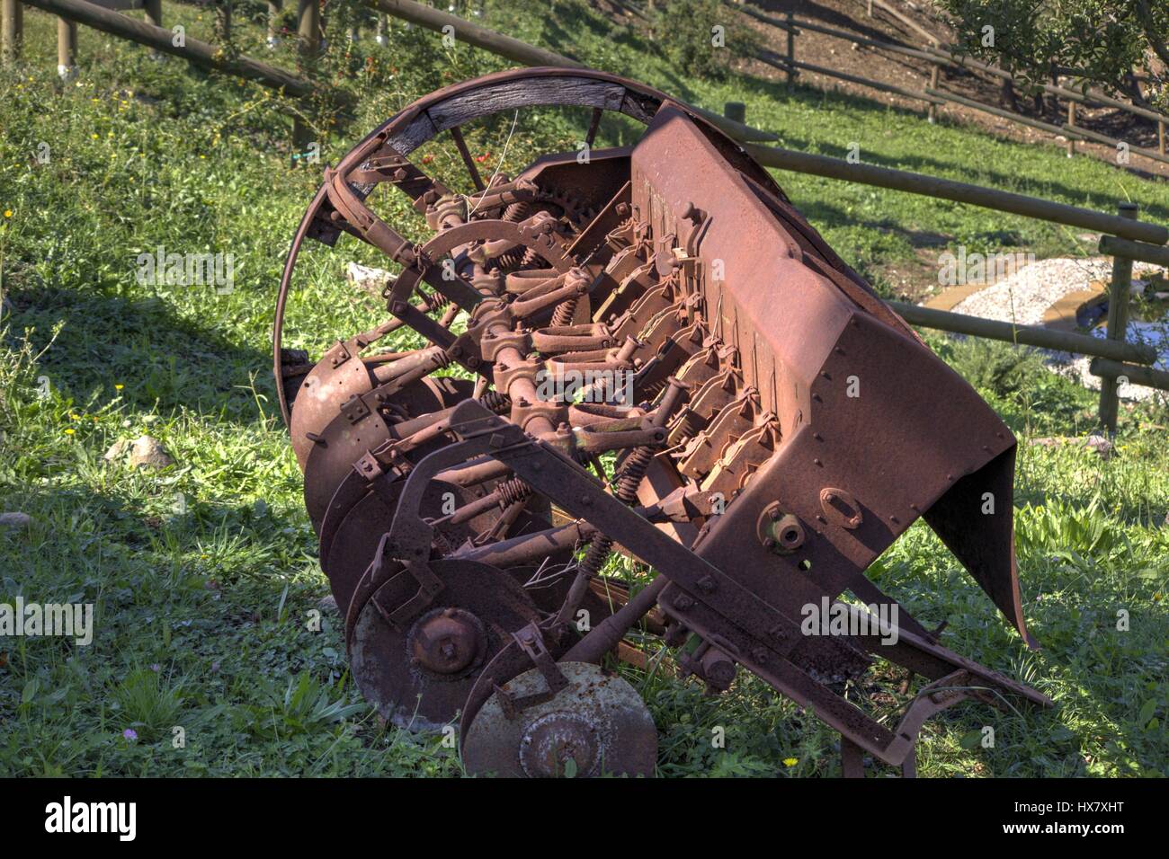 An old and blighted plow standing in a green field Stock Photo - Alamy