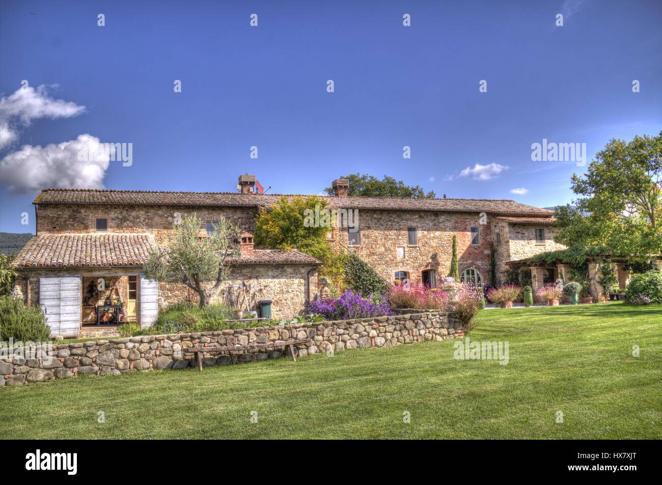 A typical tuscan country cottage, made with red bicks and with a nice ...