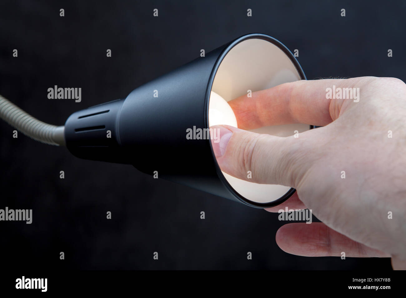 Hand twists bulb hi-res stock photography and images - Alamy