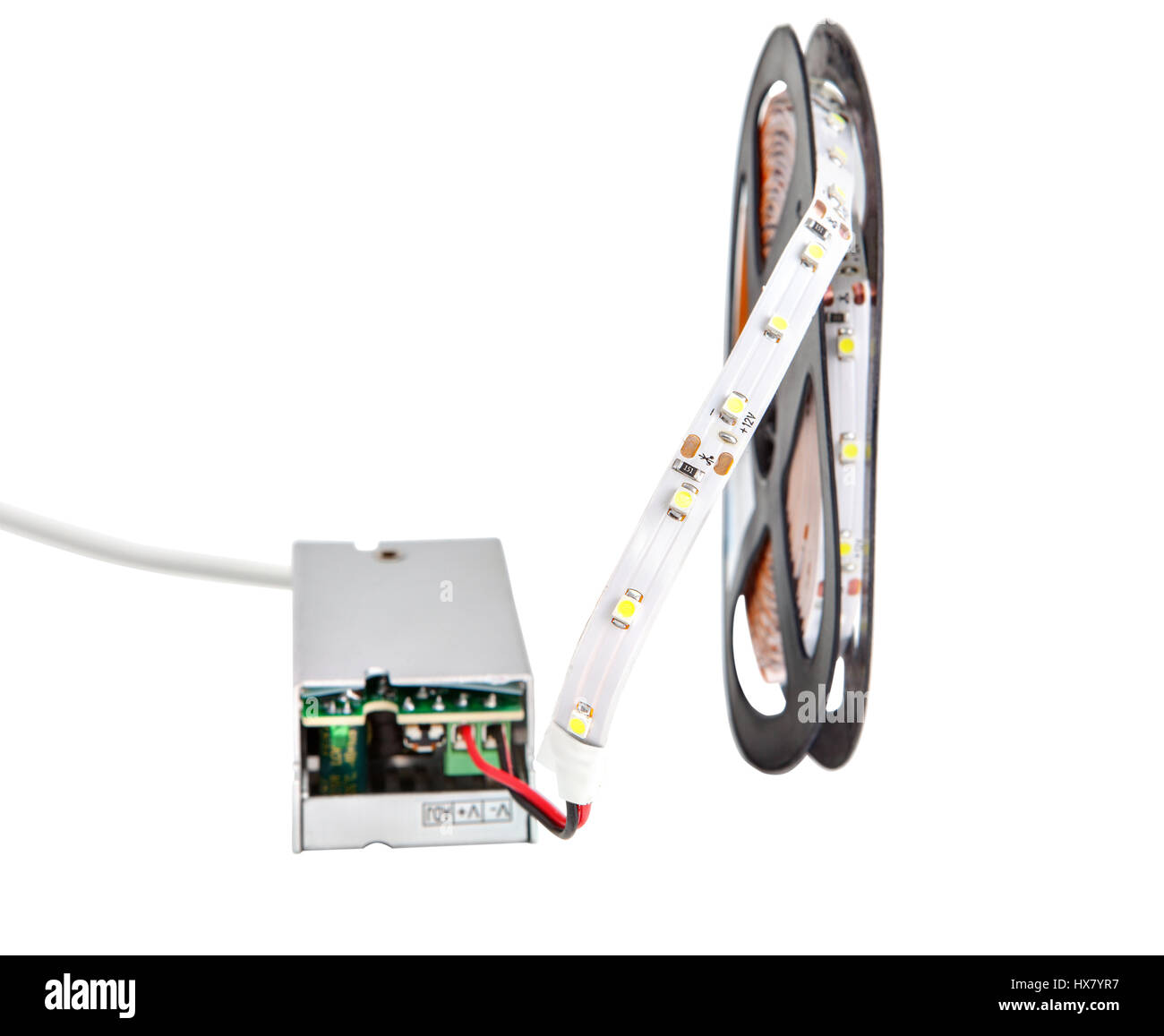 Close-up of LED strip on the plastic coil, connected to a voltage ...