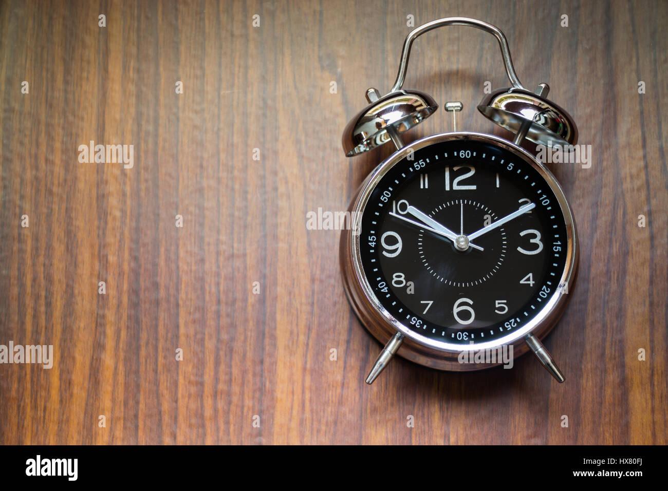 Alarm Clock On Wooden Background Stock Photo - Alamy