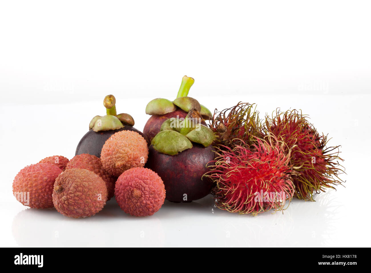 Tropical fruit including Lichee, mangosteen and rumbutan on white ...