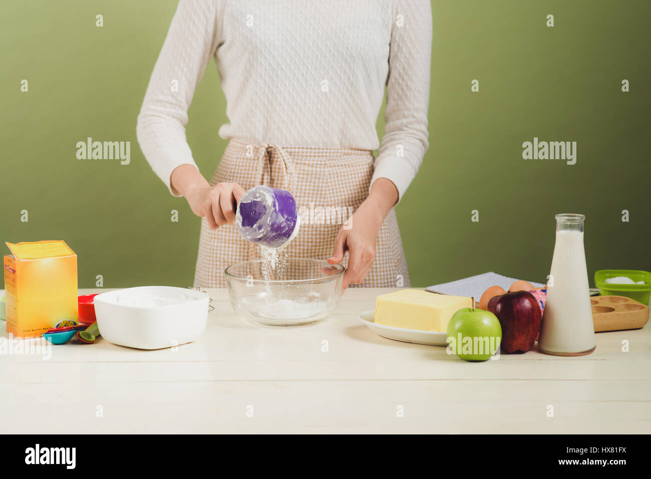 House wife wearing apron making. Steps of making cooking cake Stock ...