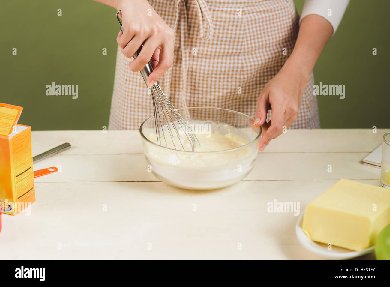 House wife wearing apron making. Steps of making cooking chocolate cake ...