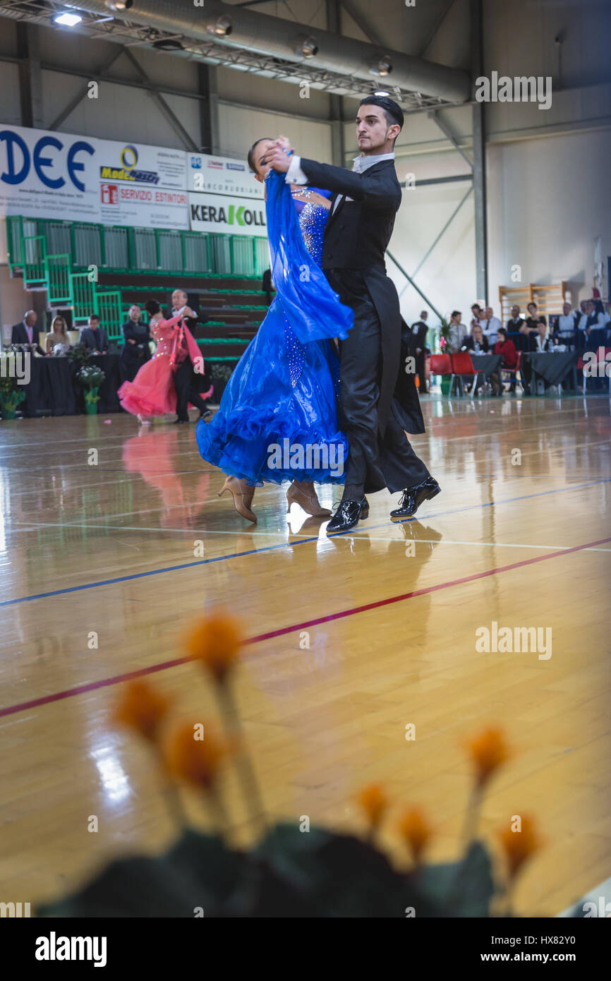 Dancers at Italian National Championship of dance. Orange flowers in ...