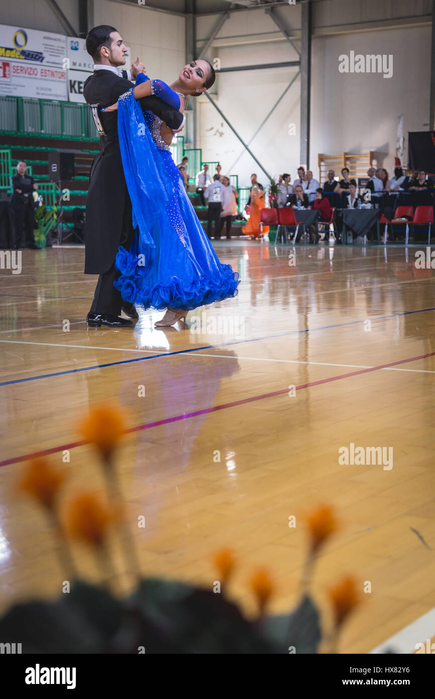 Dancers at Italian National Championship of dance. Orange flowers in ...