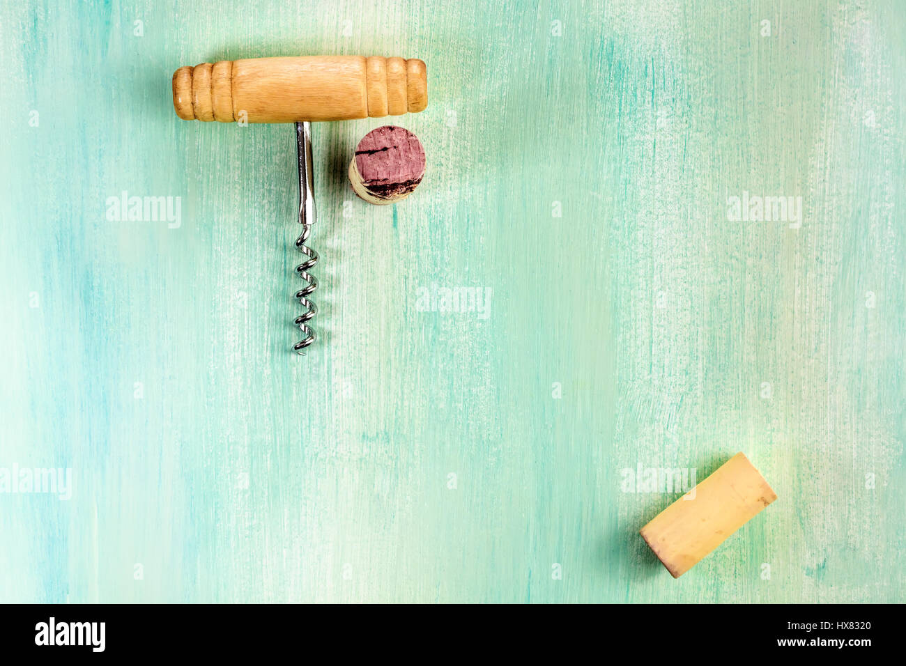A photo of an old-fashioned corkscrew with a cork, shot from above on a ...