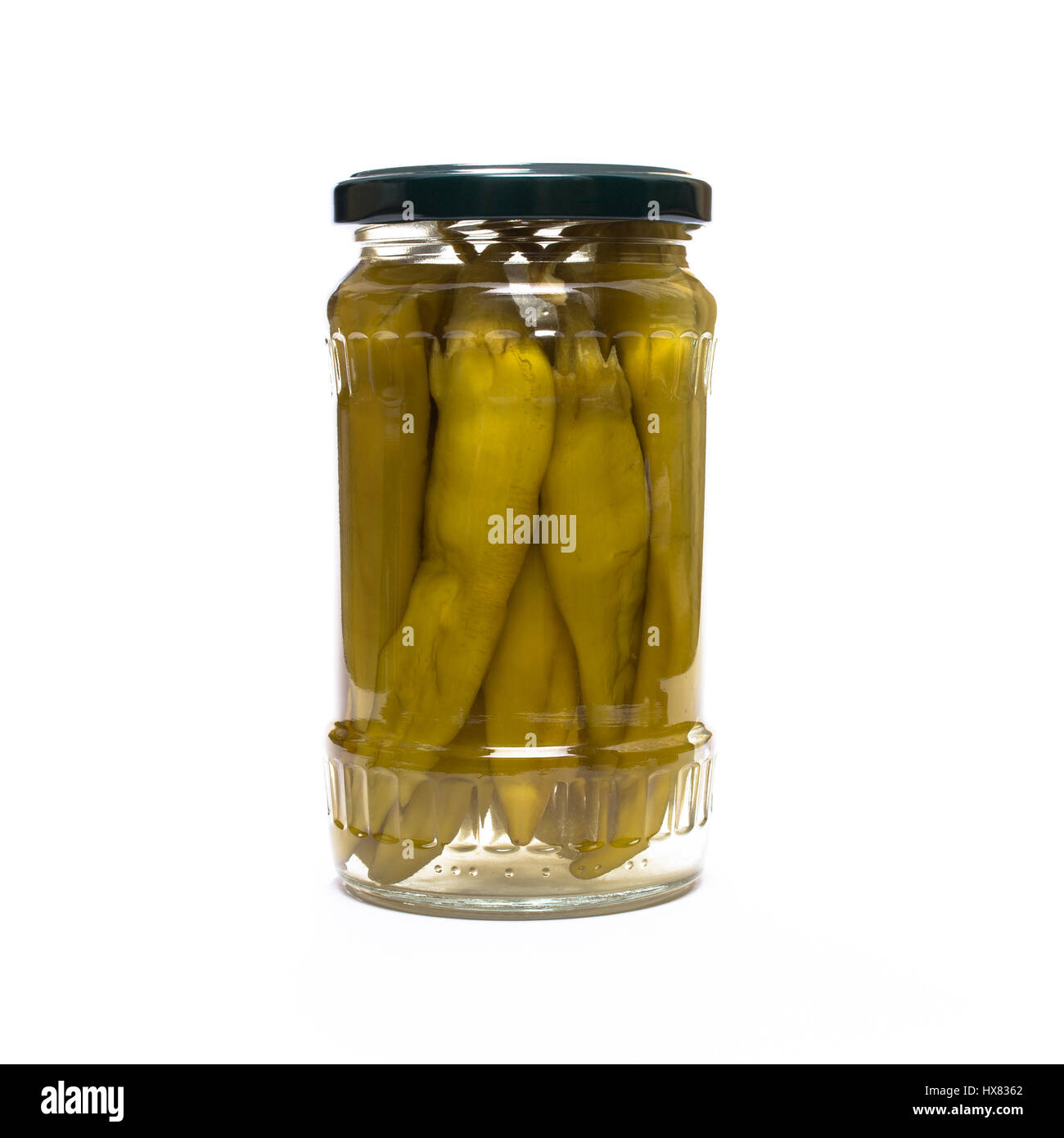 Hot green pepperoni pepper in a glass with screw cap Stock Photo - Alamy