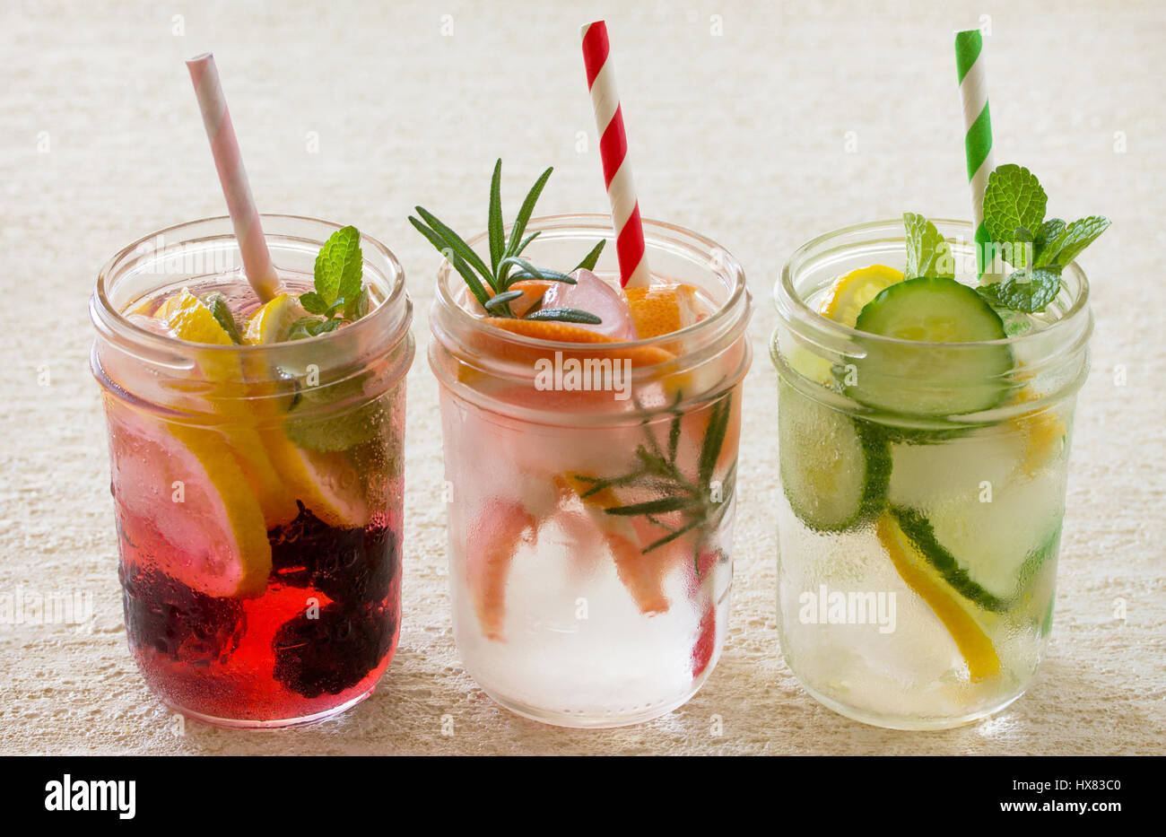Fruit refreshing water. Various summer drinks with blackberries ...