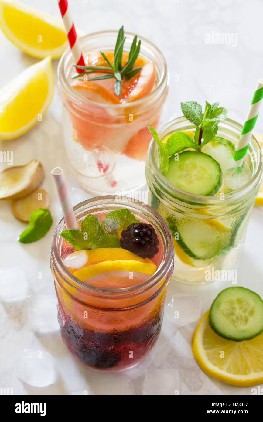 Fruit refreshing water. Various summer drinks with blackberries ...
