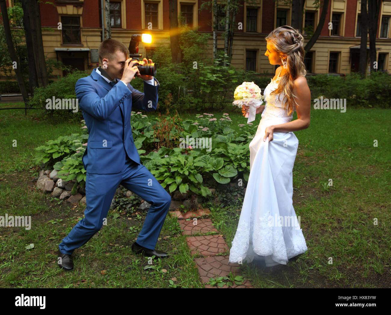 Professional wedding photographer takes a picture of the bride, camera ...