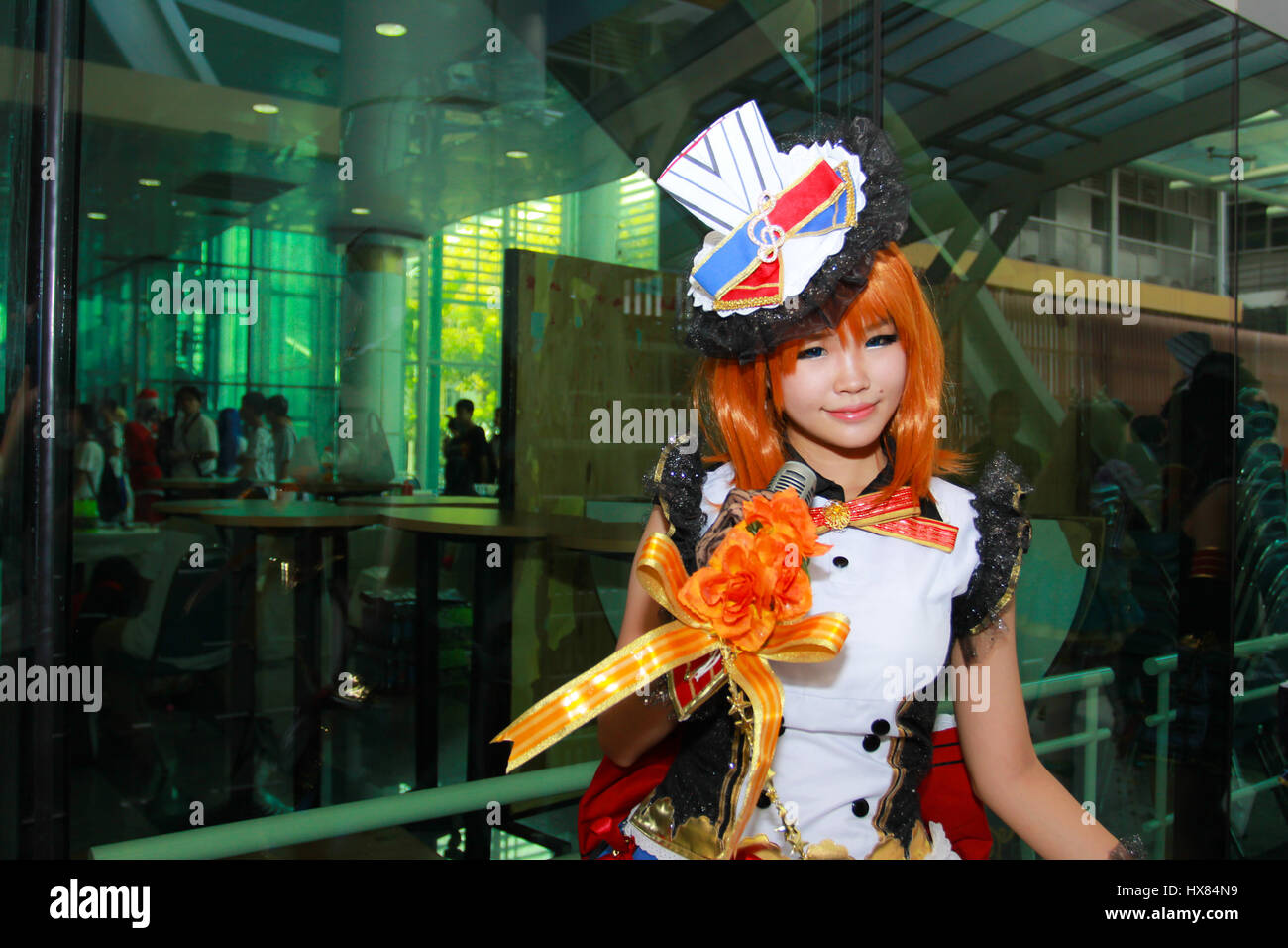 Bangkok - Dec 28: An unidentified Japanese anime cosplay pose in COSCOM ...