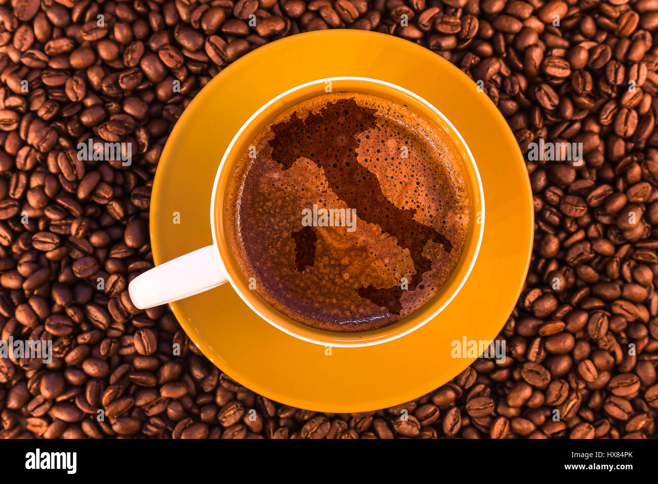 map of Italy on fresh espresso with a beautiful crema and strewn ...