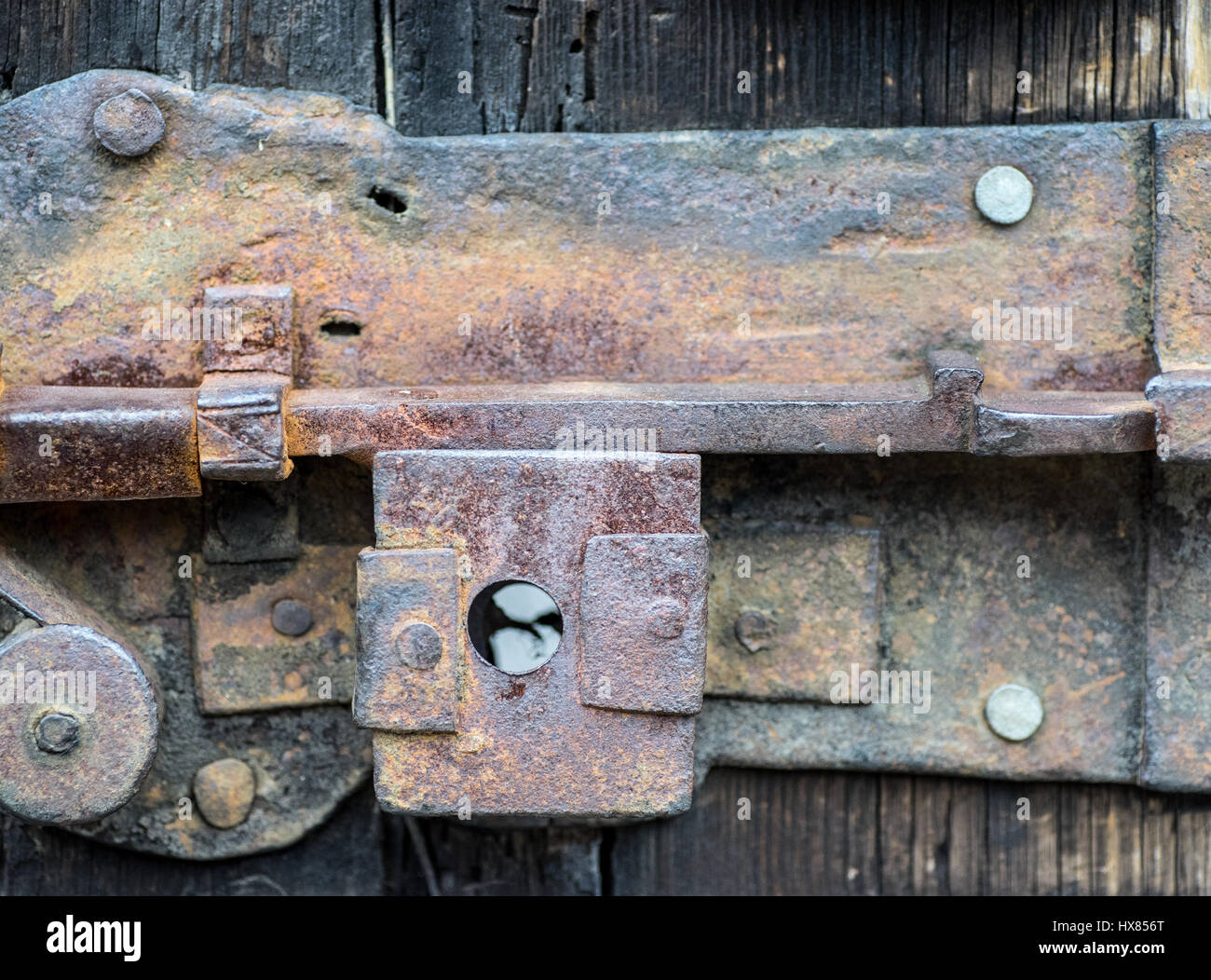 Detail of rusty iron door lock, rusty old latch lever lock, on a ...