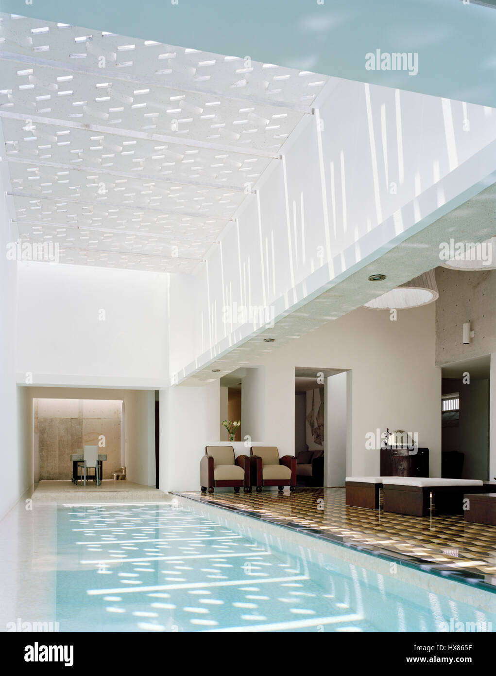 Interior view of living room with pool in the former interior courtyard ...