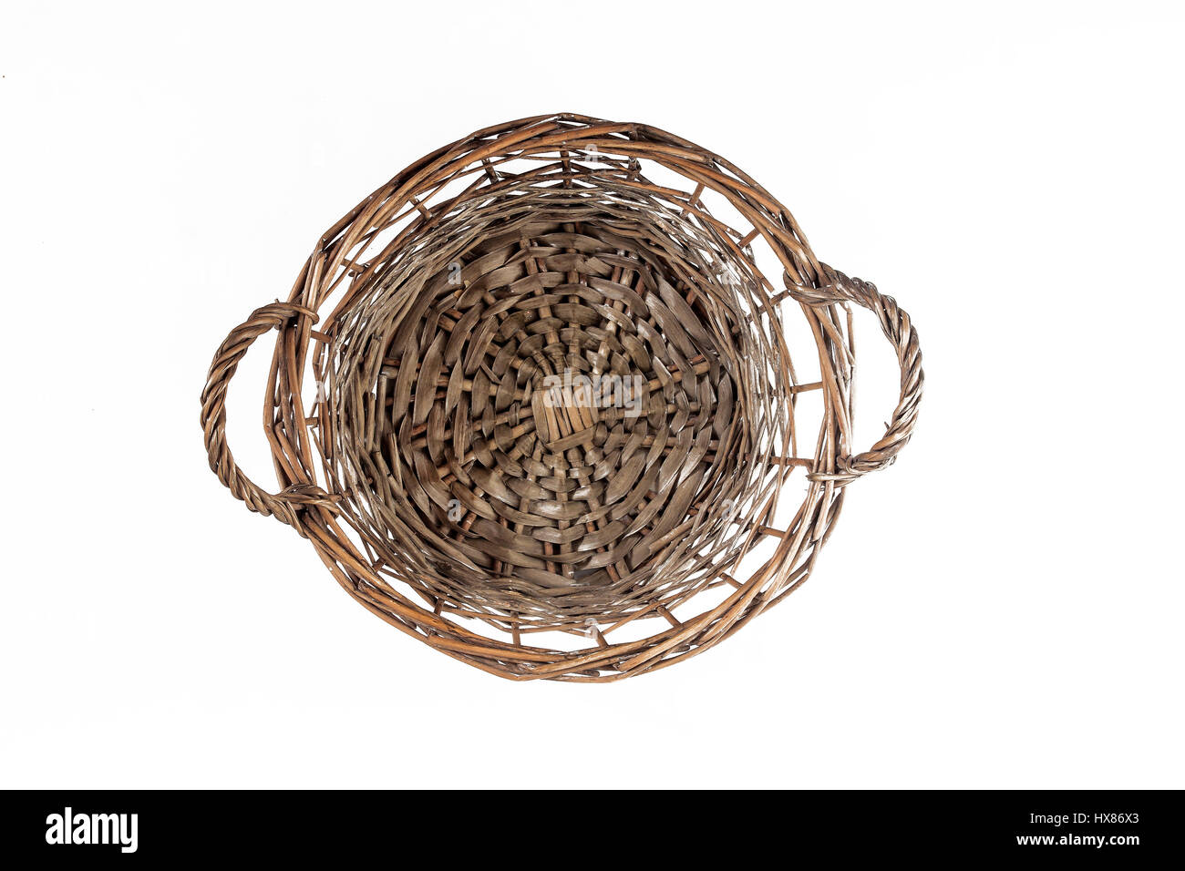 Top view of a wicker basket with handles, isolated Stock Photo - Alamy