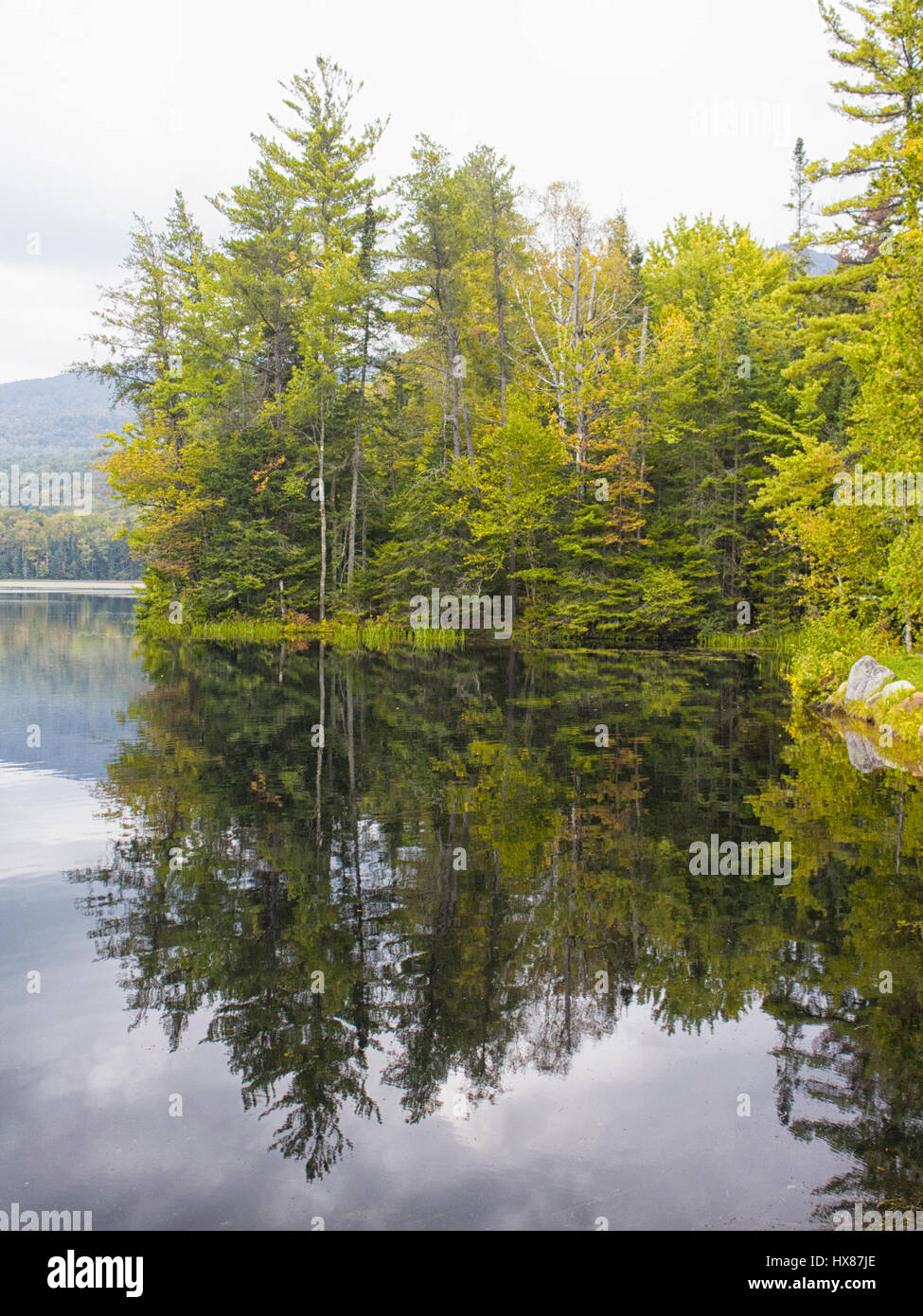 Chittenden Reservoir early fall reflection in Vermont Stock Photo - Alamy