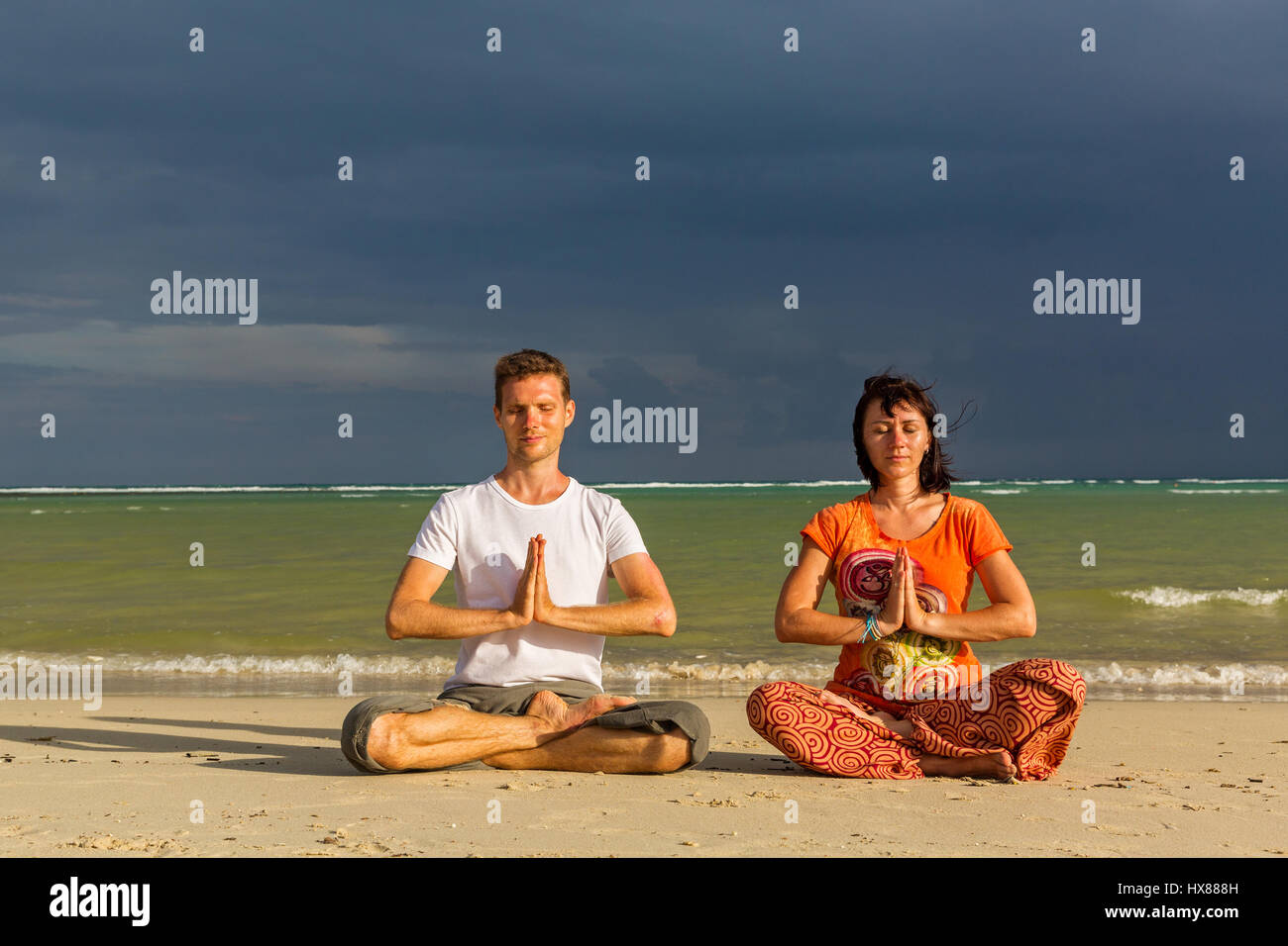 Couple in lotus position hi-res stock photography and images - Alamy