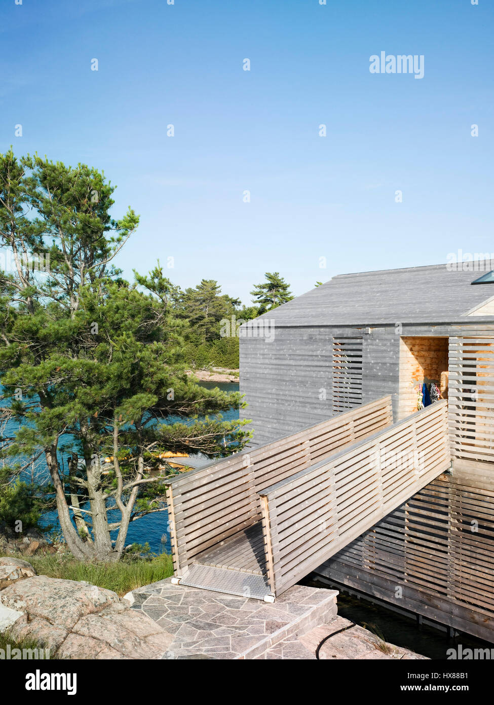 Footbridge connecting the upper floor of the house to the island ...