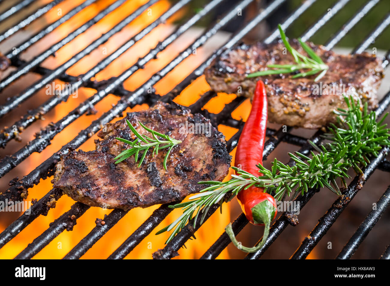 Closeup of steak roasted on the fire grill Stock Photo - Alamy