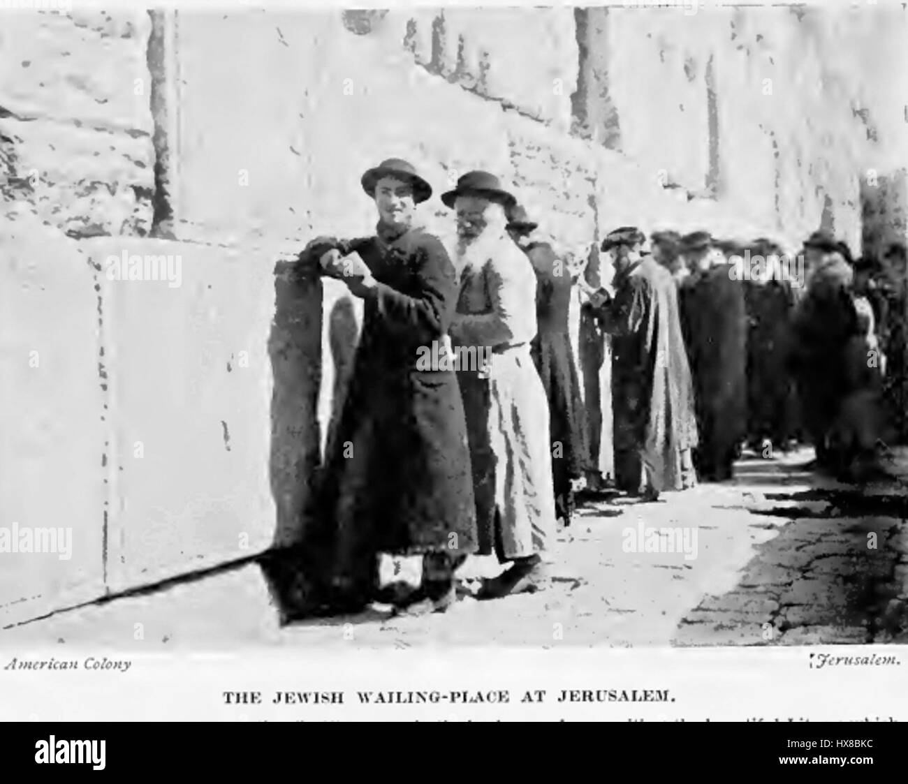 This photograph titled 'Walling Wall 1913' captures a historical moment ...